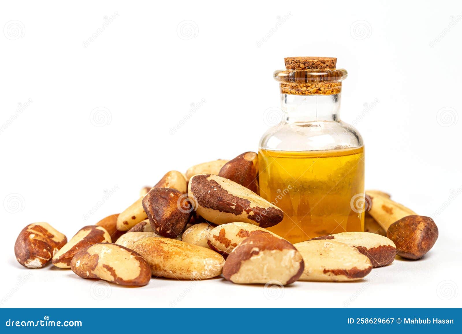 Oil Bottle and Pile of Brazil Nuts on White Stock Image - Image of ...