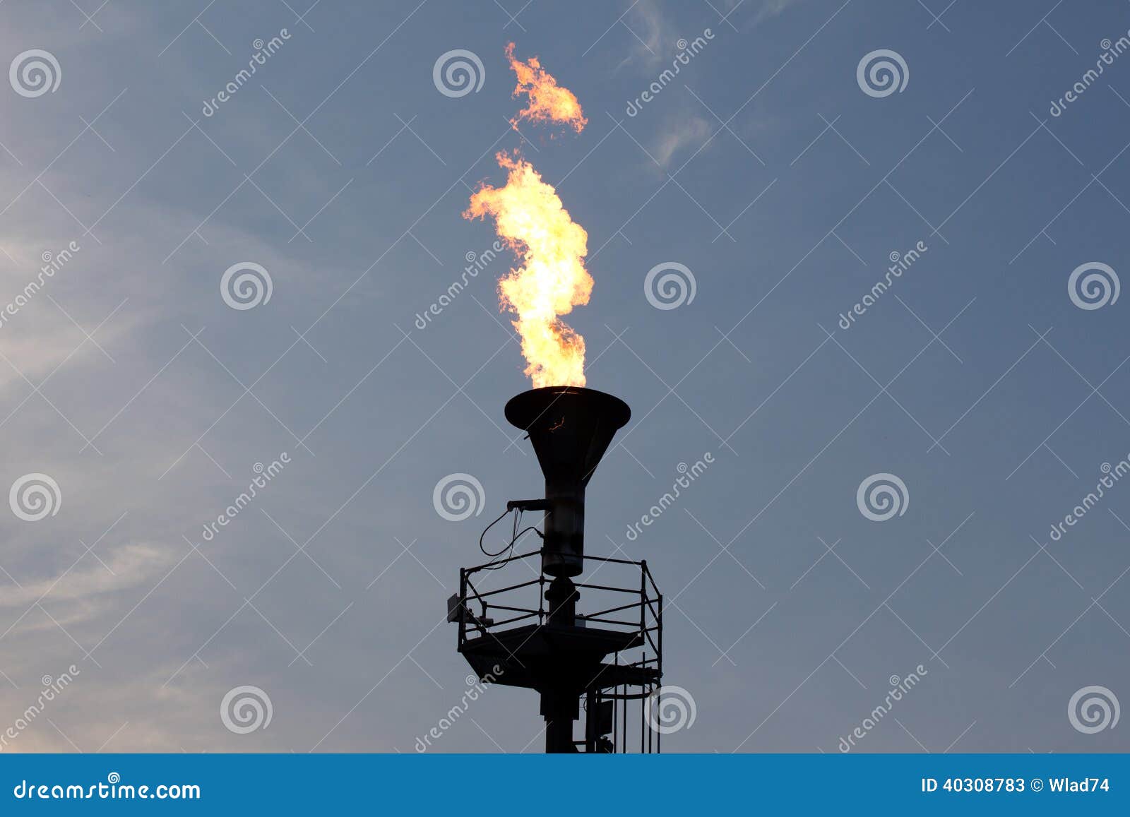 Oil Burning Torch Against Blue Sunset Sky Stock Image - Image of ...