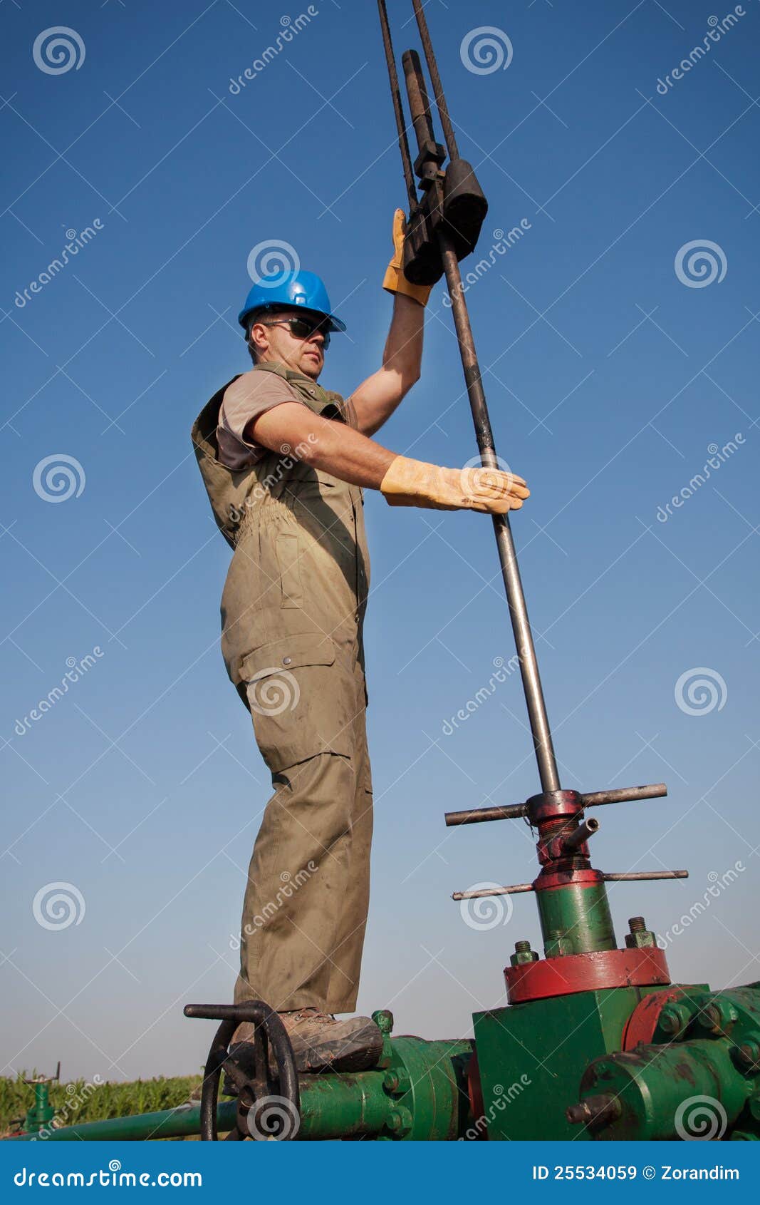 Oil Company Worker on the Well Stock Image - Image of blue, jack: 25534059