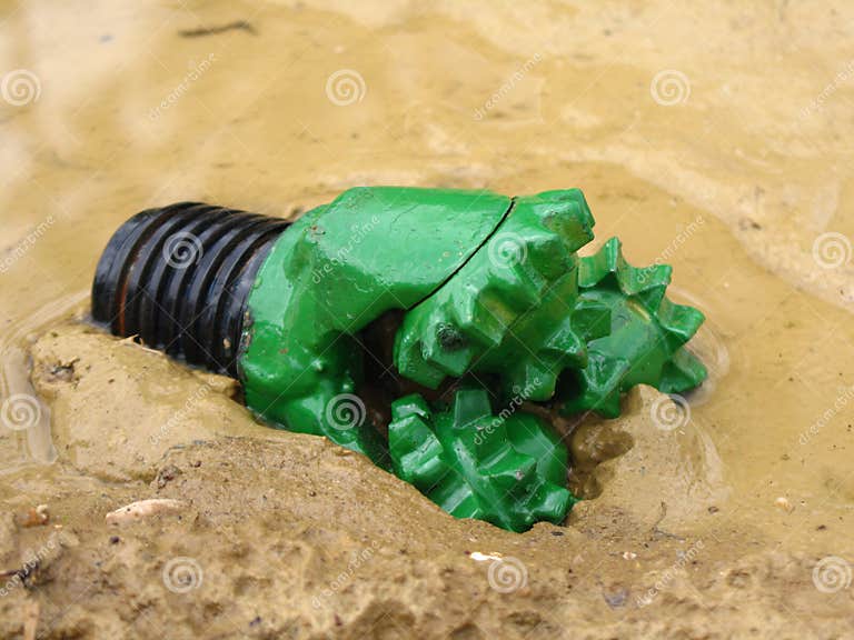 Oil drilling bit in mud stock photo. Image of industry - 4772828