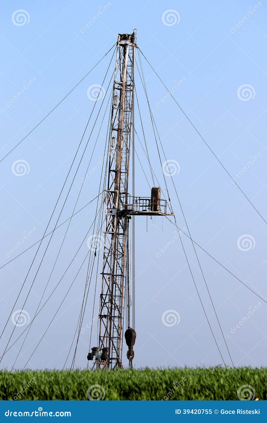Oil Drilling Rig Behind Green Wheat Stock Photos - Free & Royalty-Free ...