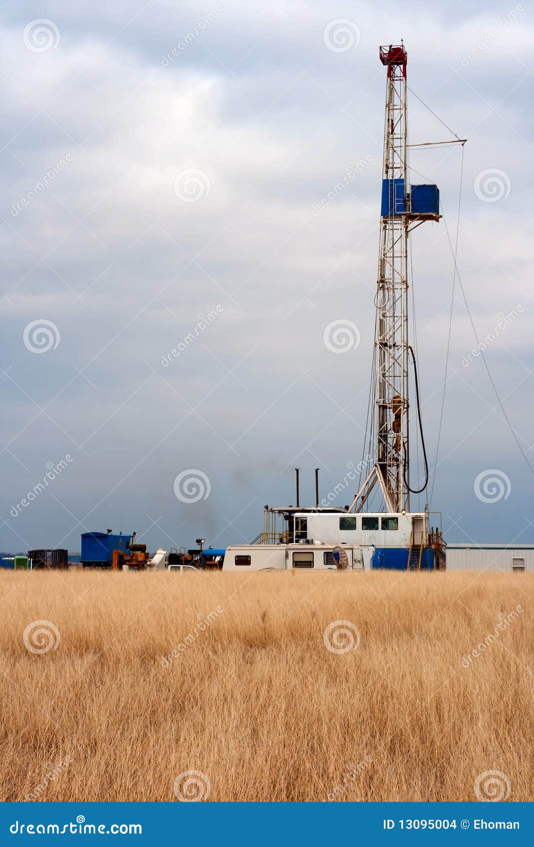 Oil Drilling Rig in a Hay Field Stock Photo - Image of drilling, field ...