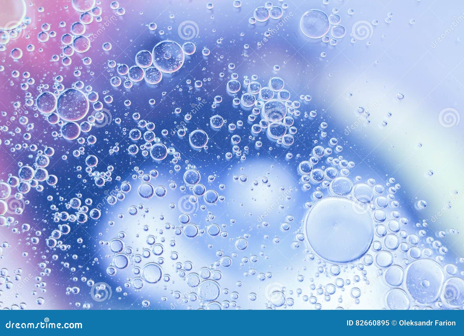 Oil Drops Floating in Water Abstract Blue Color Background. Stock Image ...