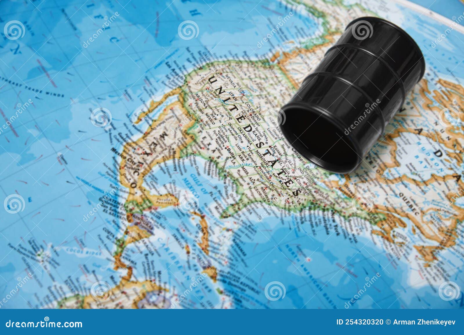 Oil Drum with Crude Petroleum Lying on a Map Stock Photo - Image of ...