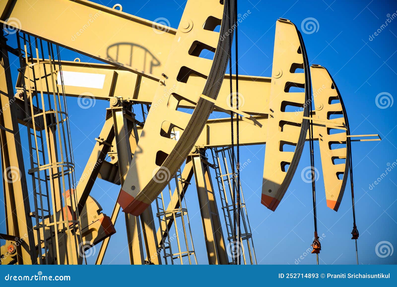 Oil Field Site, Oil Pumps are Running Stock Image - Image of evening ...