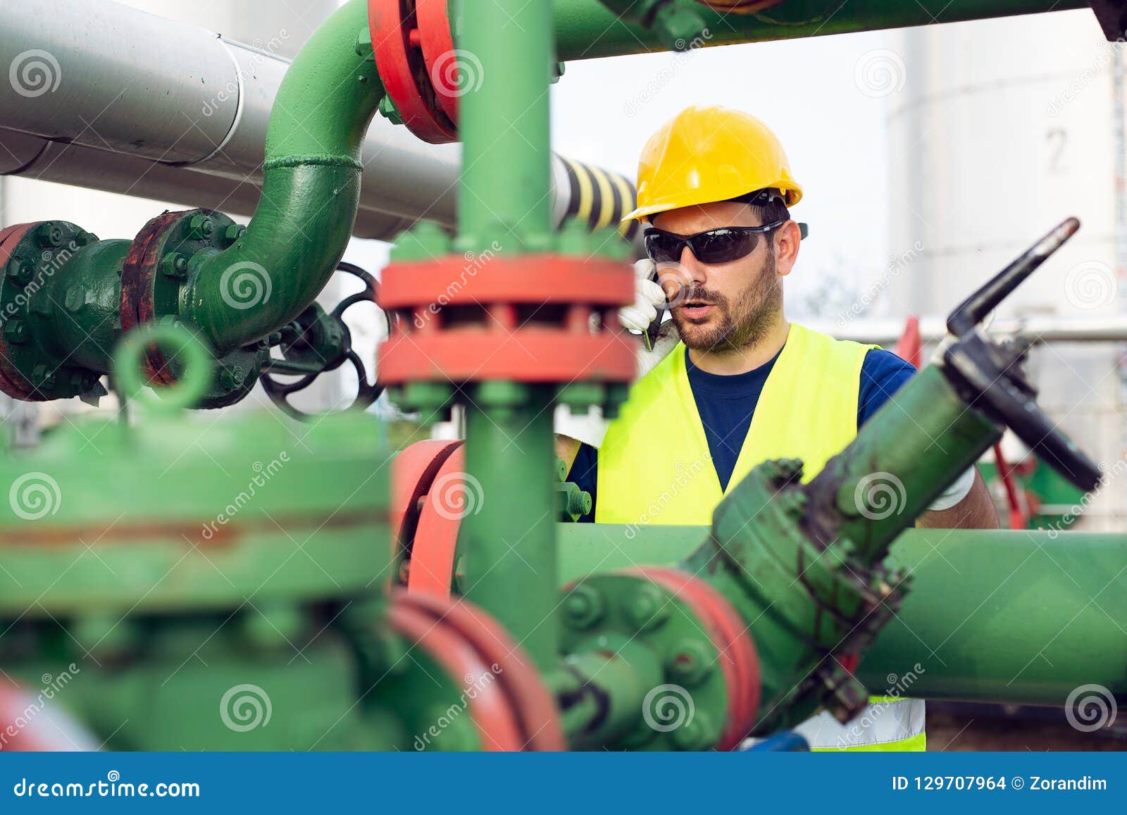 Oil and Gas and Pipelines with Engineer Talking in Phone Stock Photo ...