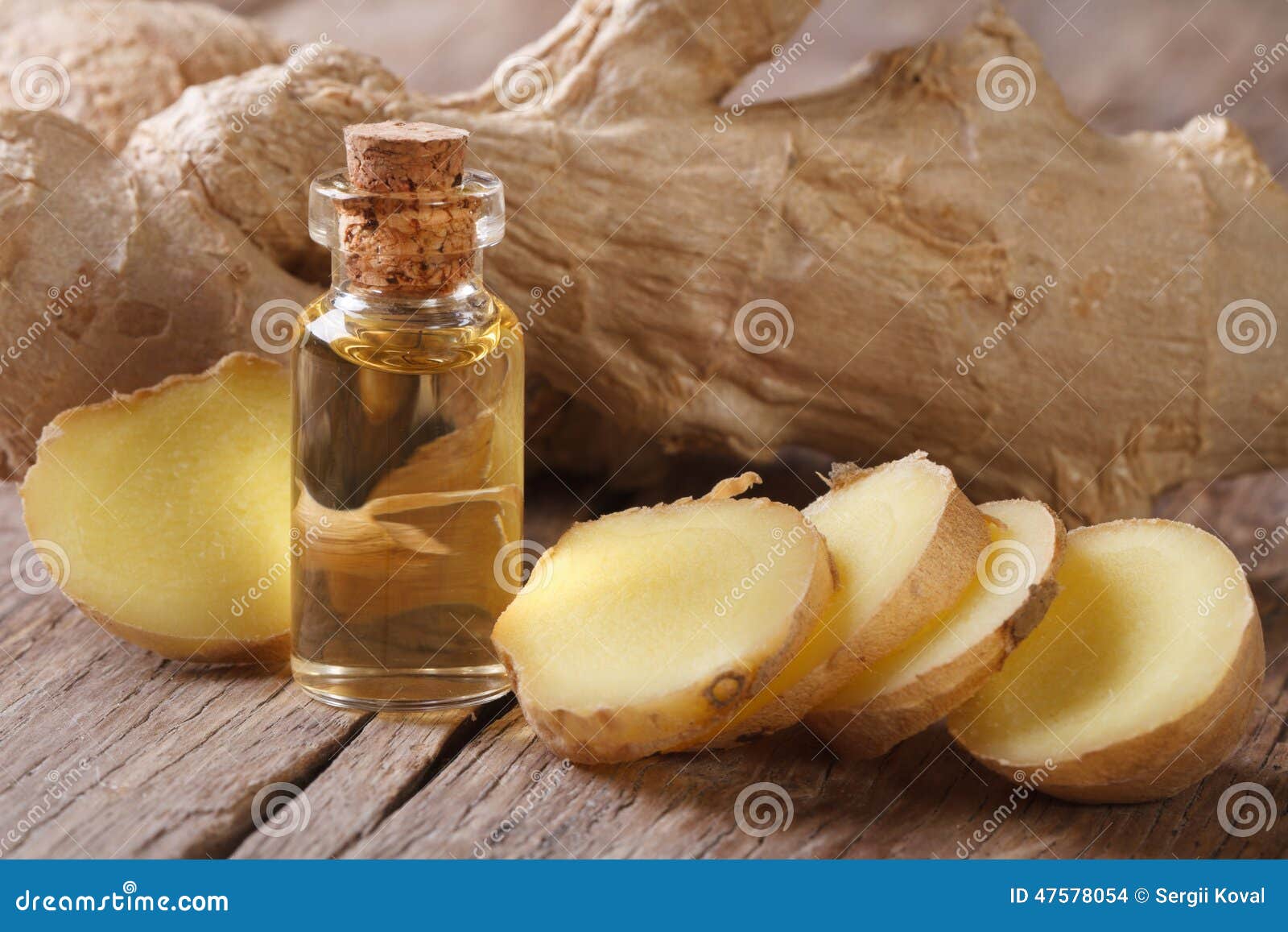 Oil of Ginger in a Small Glass Bottle Macro and Root Stock Photo ...