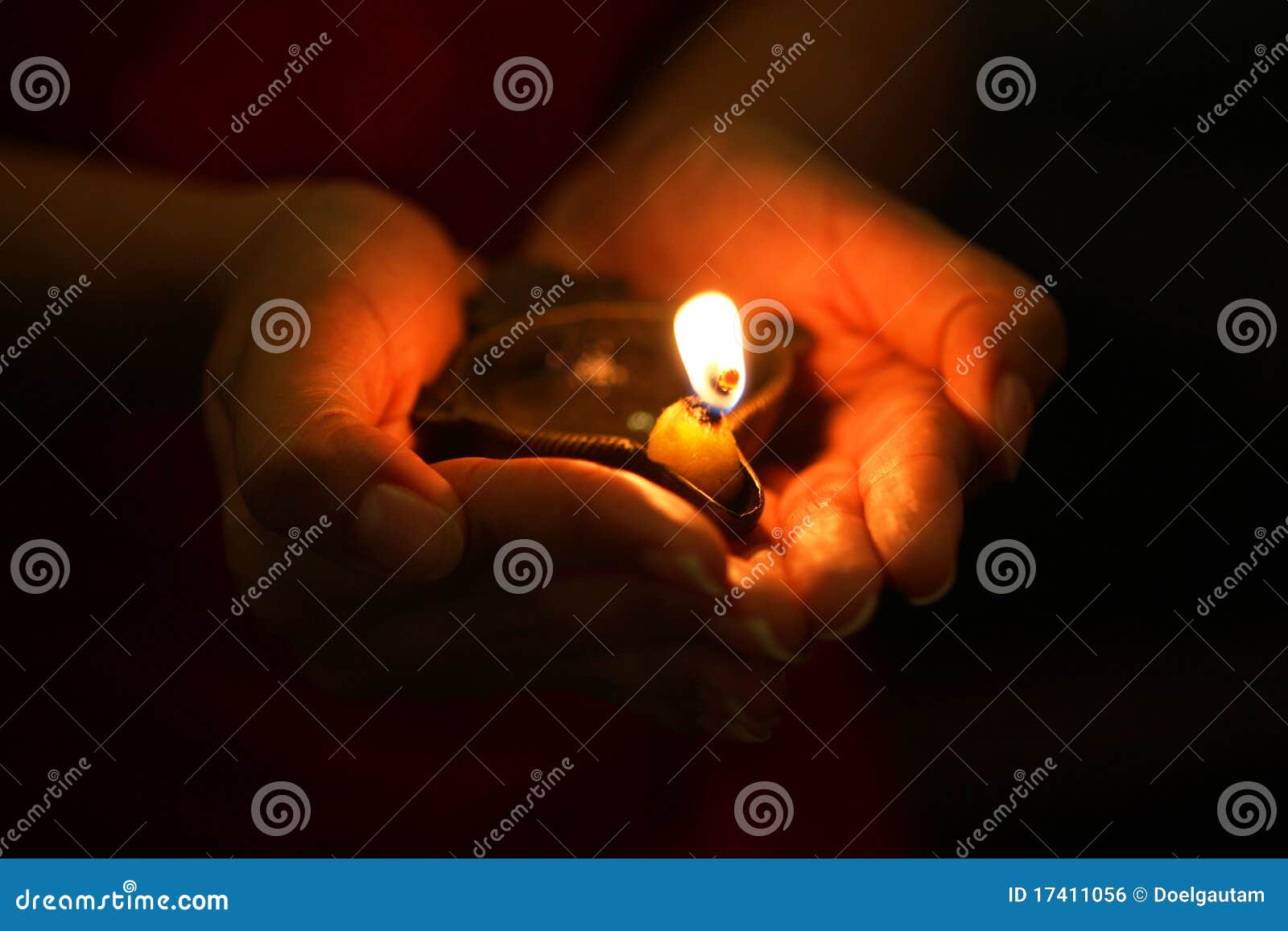 Oil lamp in hands stock photo. Image of light, hindu - 17411056