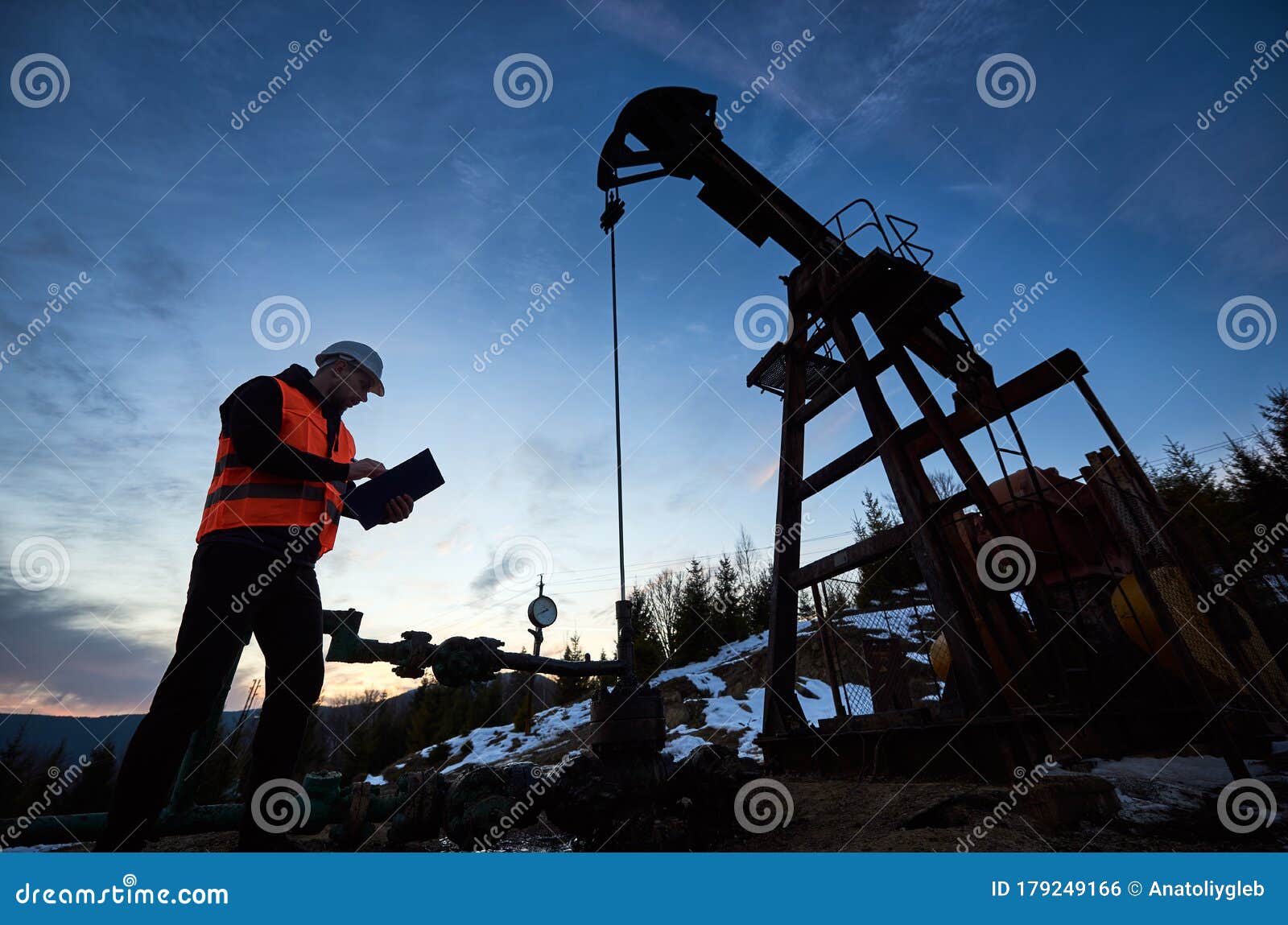 Oil Man Controlling Work of Petroleum Pump Jack. Stock Photo - Image of ...
