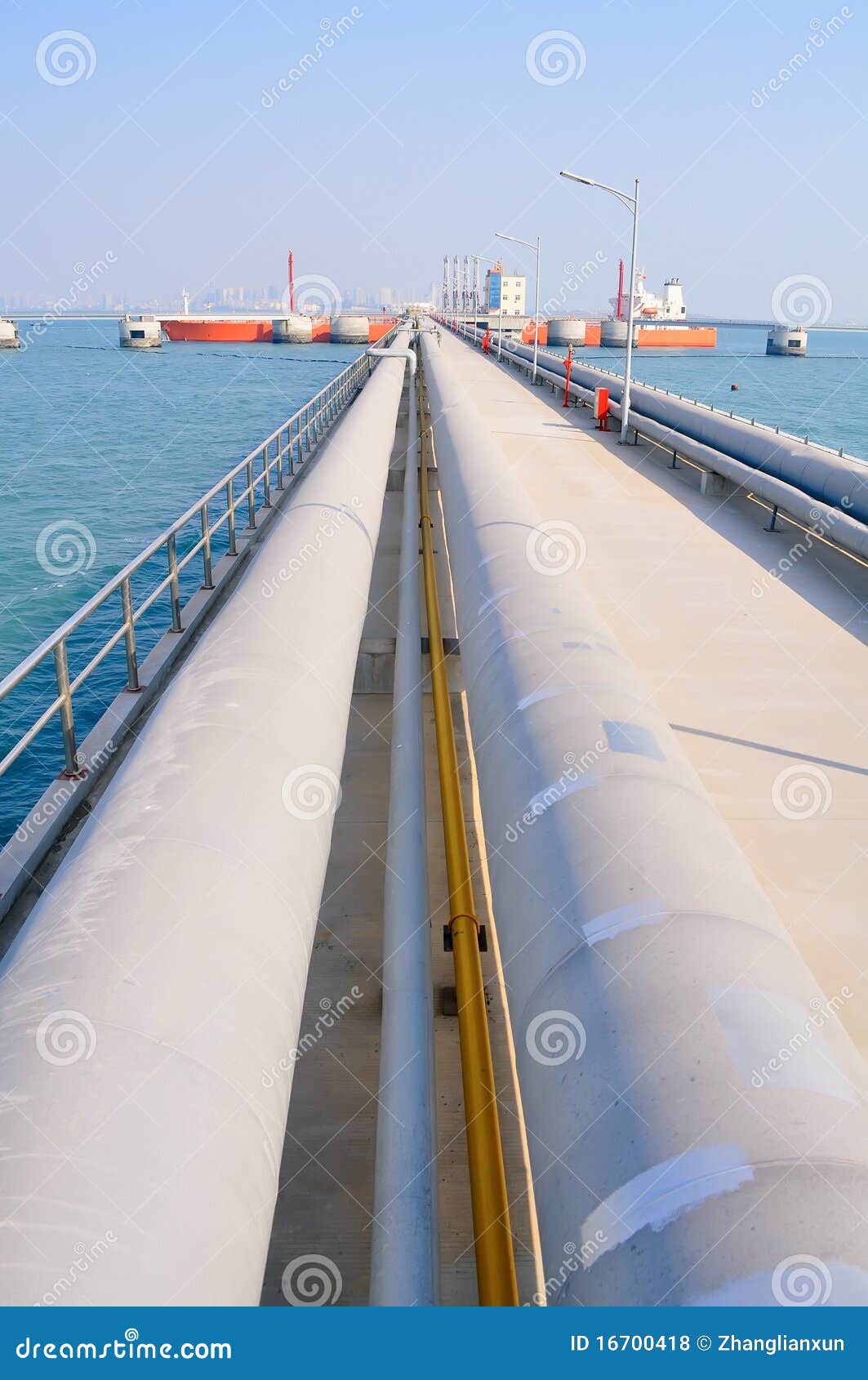 Oil Pipeline at the pier stock photo. Image of warehouses - 16700418