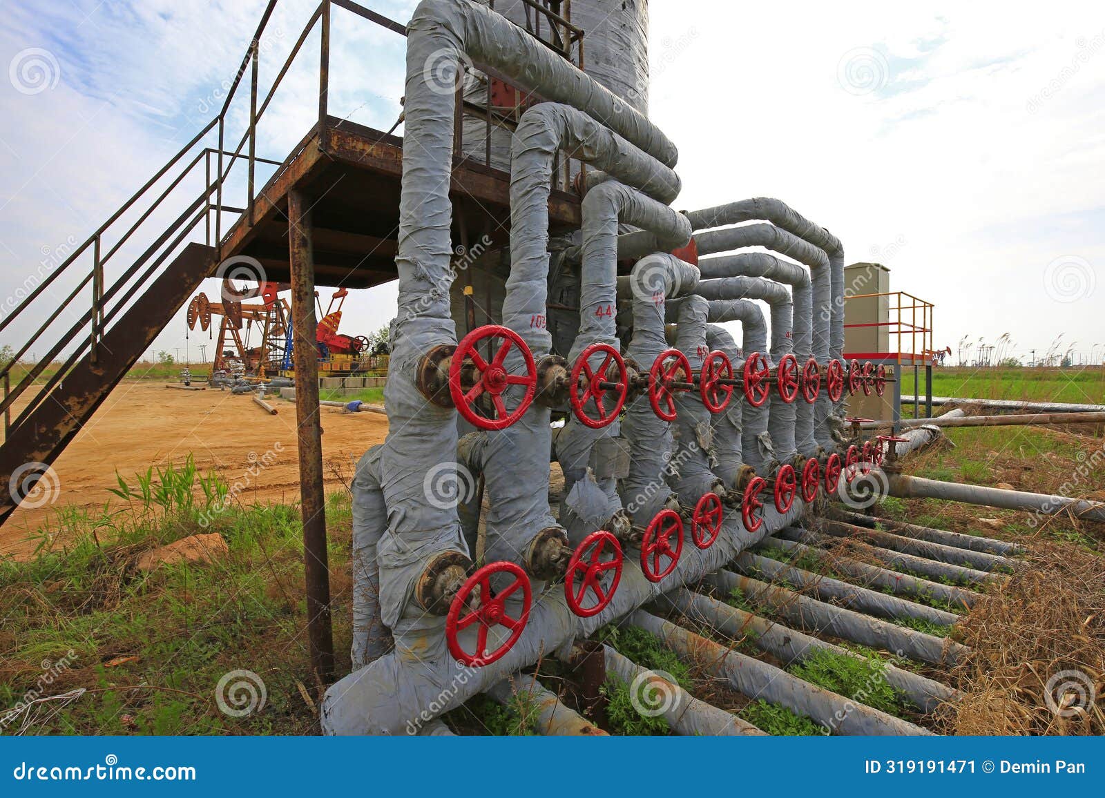 Oil pipes and valves stock image. Image of manufacturing - 319191471