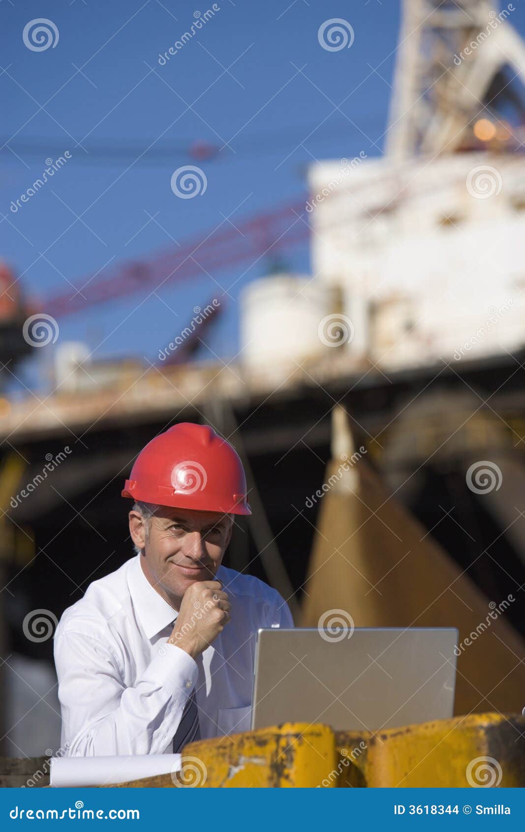An Oil Platform Inspector with His Laptop Stock Photo - Image of ...