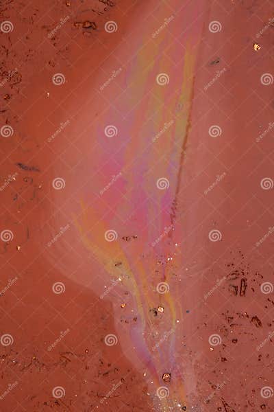 Oil in the red sludge stock photo. Image of pollution - 16724718