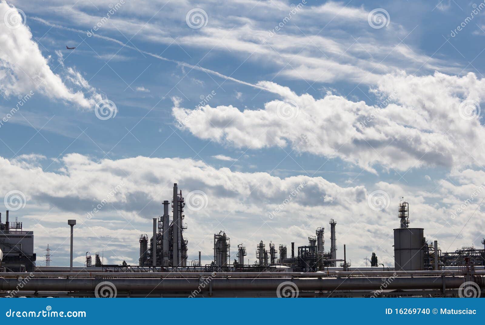 Oil refinery over blue sky stock photo. Image of platform - 16269740