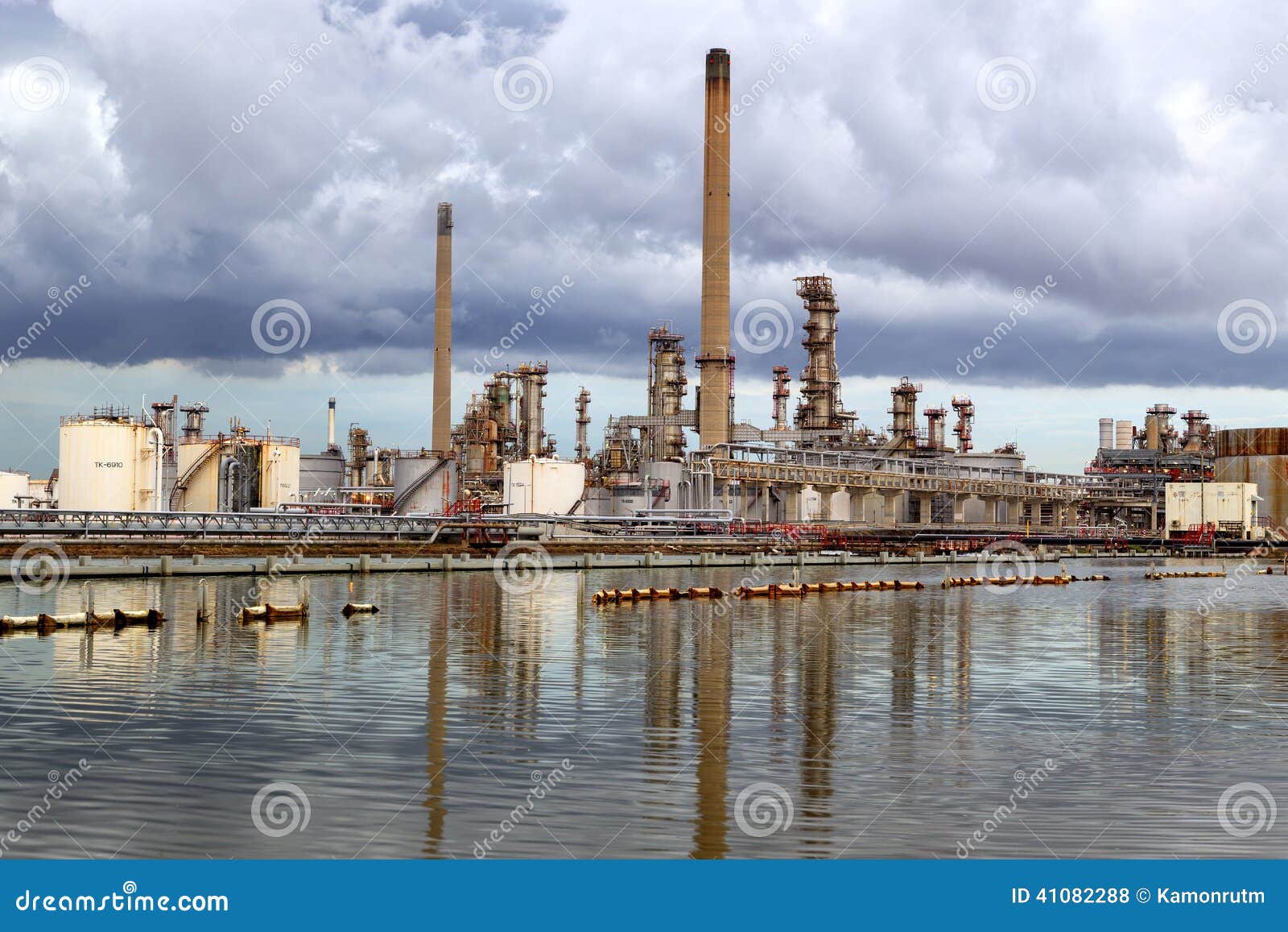 Oil refinery plant against stock photo. Image of night - 41082288