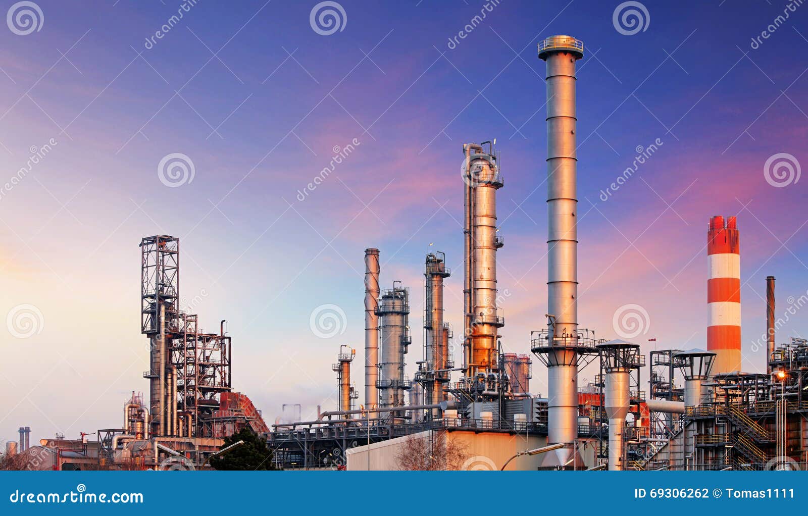 Oil refinery at sunset stock photo. Image of environment - 69306262