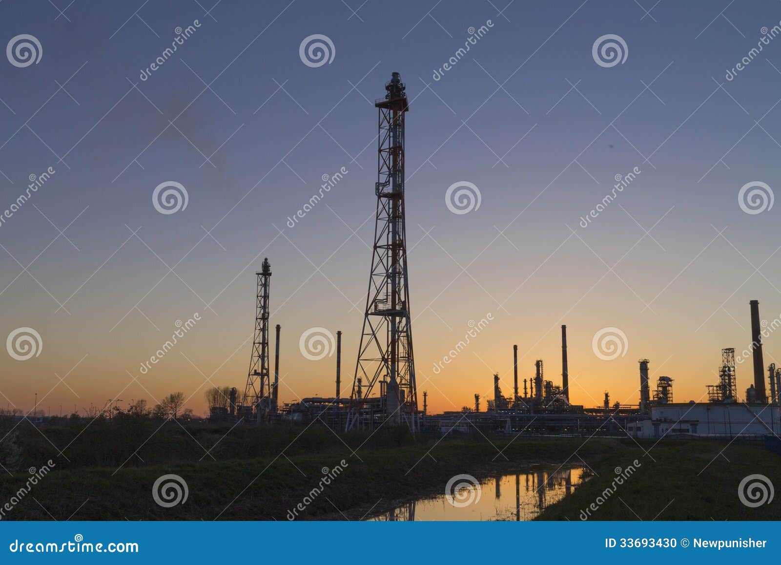 An oil refinery at sunset stock photo. Image of engineering - 33693430