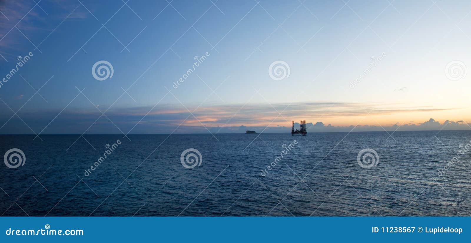 Oil Rig Anchored Offshore and Small Island Stock Image - Image of wied ...