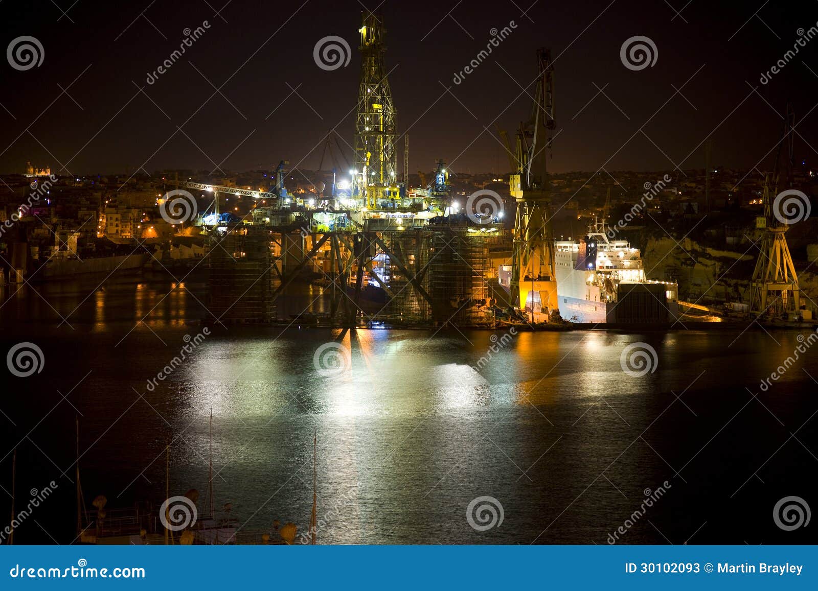 Oil Rig at night Malta stock image. Image of scaffolding - 30102093