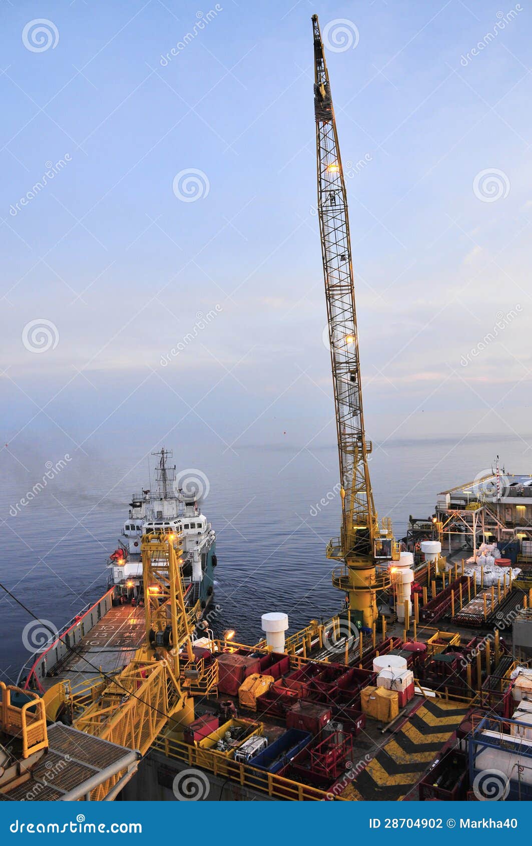 Oil rig and loading ship stock photo. Image of cranes - 28704902