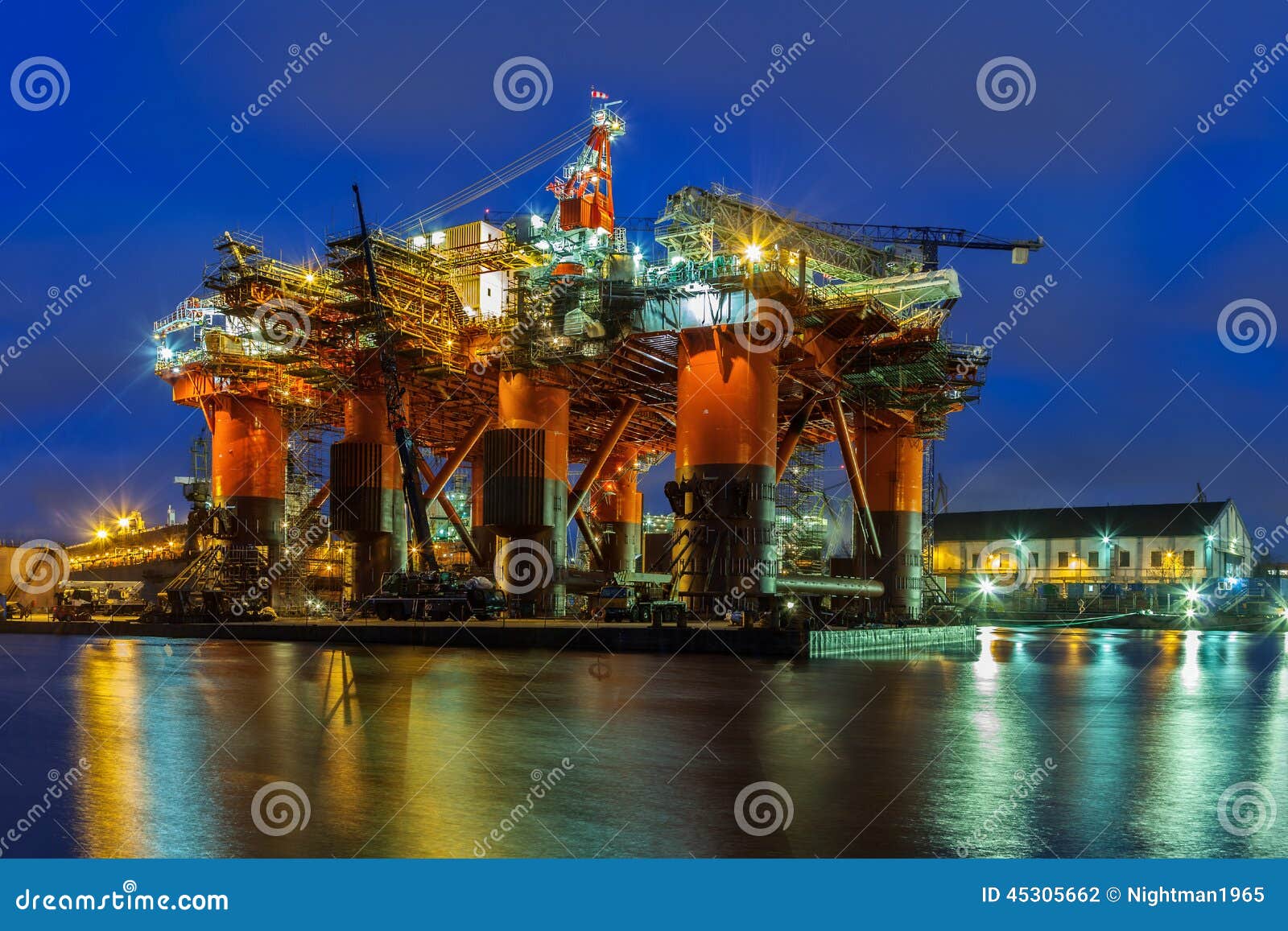 Oil Rig at night stock photo. Image of container, ocean - 45305662