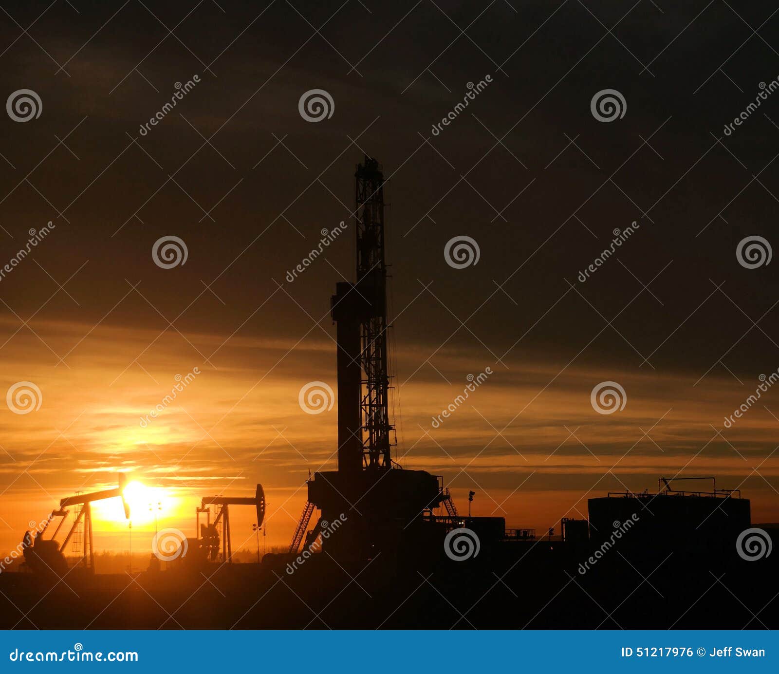 Oil rig in the sunset stock photo. Image of drilling - 51217976
