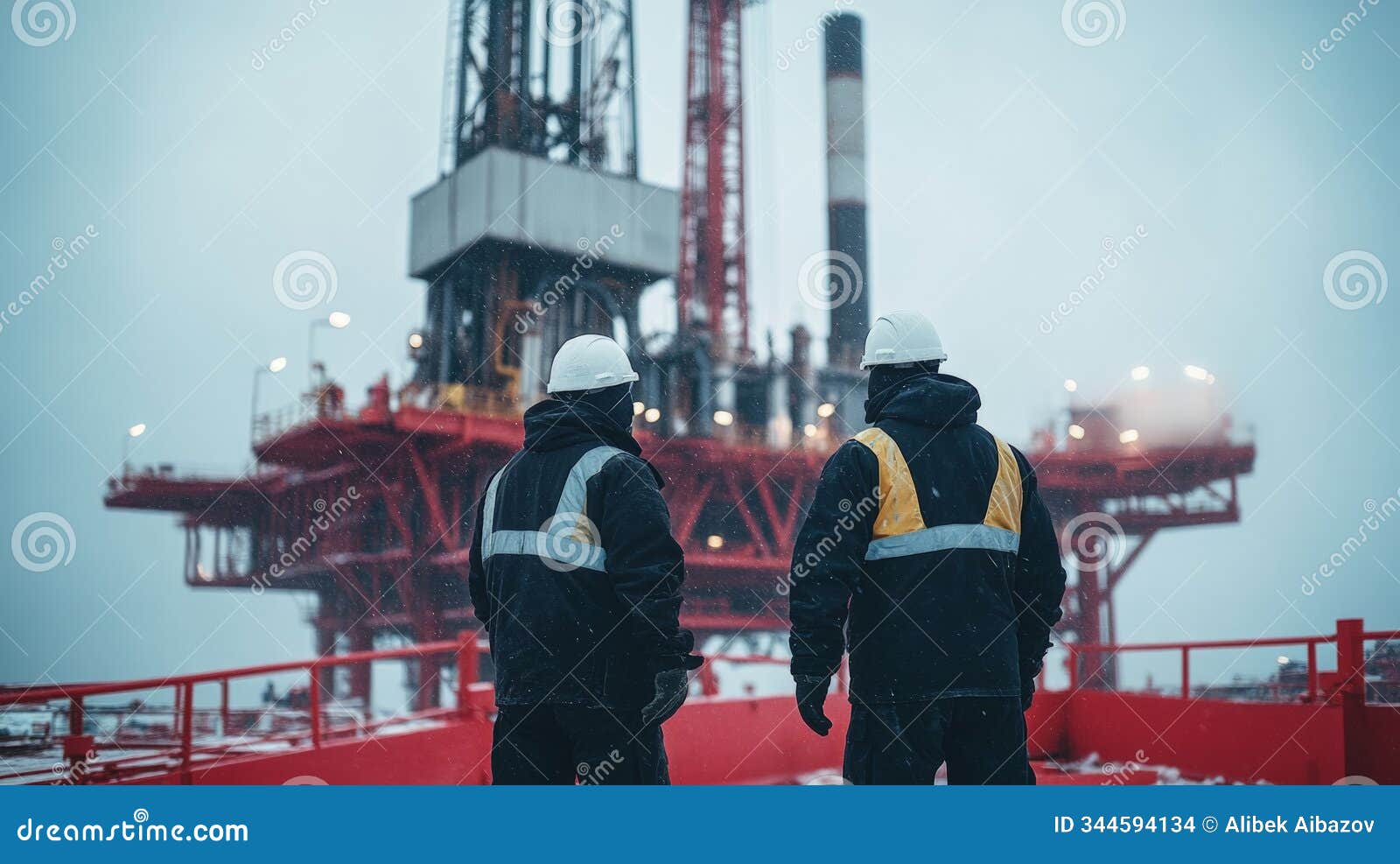 Oil Rig Workers in Protective Gear Overseeing Offshore Platform ...