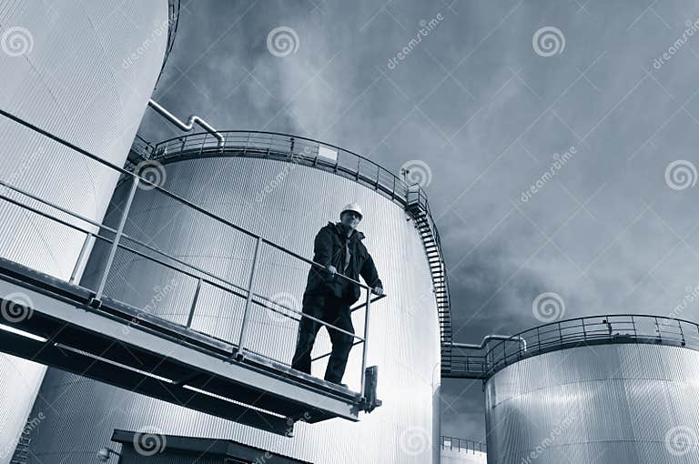 Oil tanks and engineer stock photo. Image of chemical - 3557556