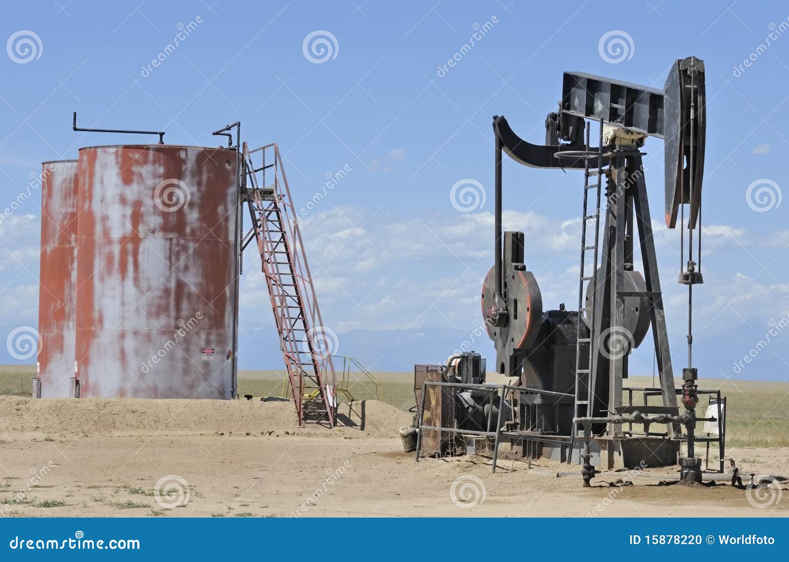 Oil well and storage tanks stock photo. Image of outdoor - 15878220