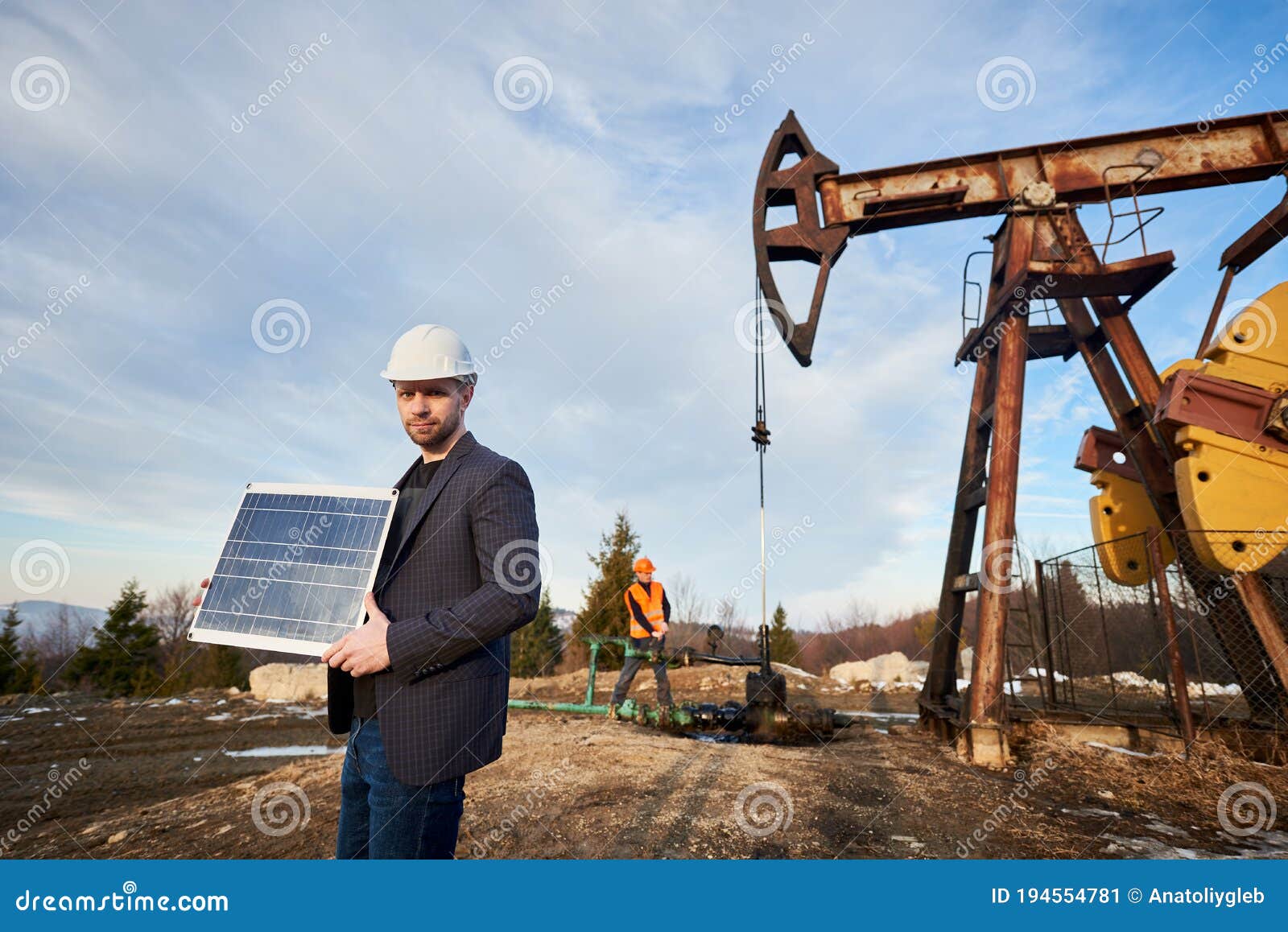 Oil Worker in Helmet Holding Solar Panel. Stock Image - Image of ...