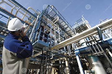 Oil worker and refinery stock photo. Image of pipes, tank - 18183220