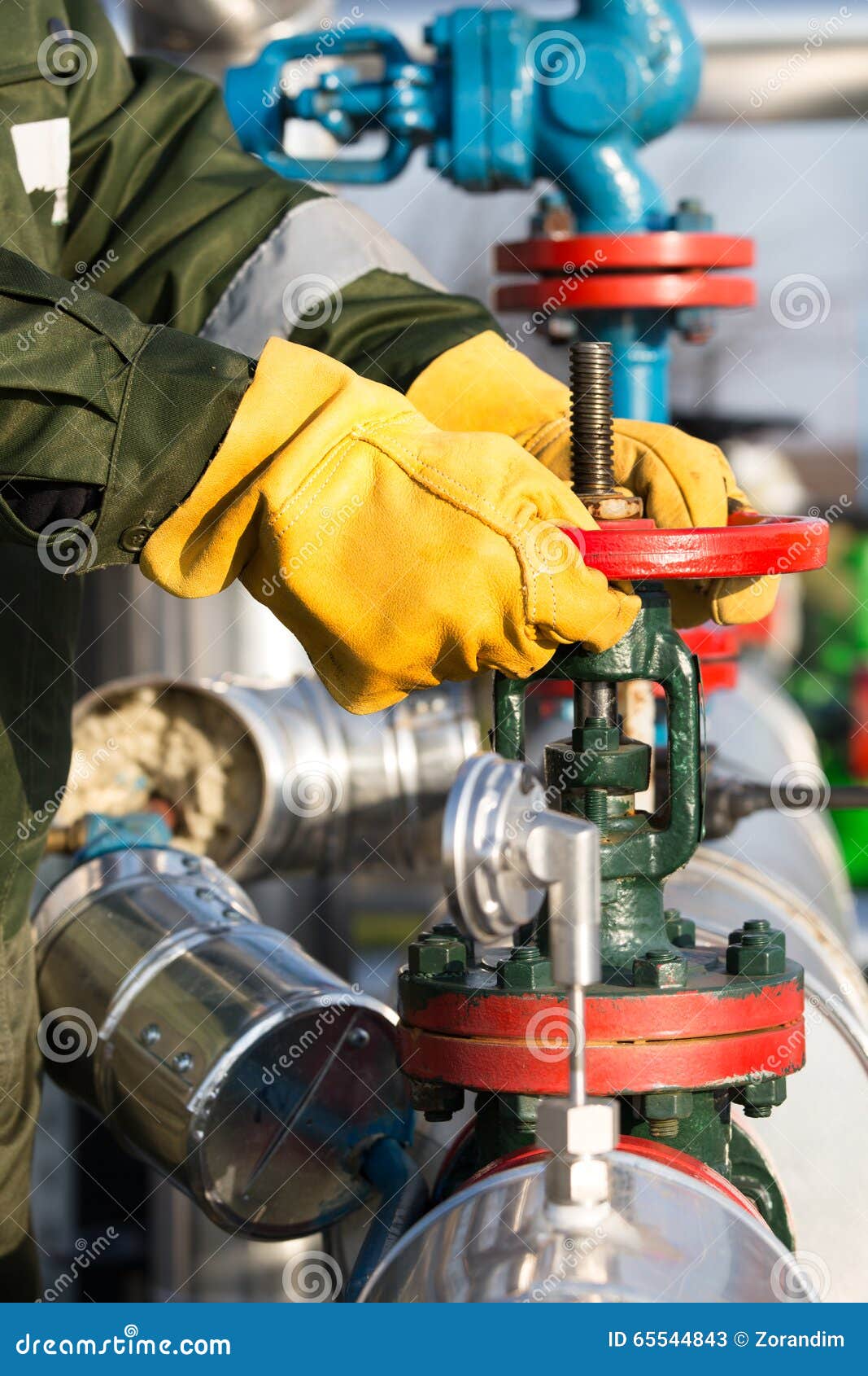 Oil Worker Turning Valve On Oil Rig Royalty-Free Stock Photo ...