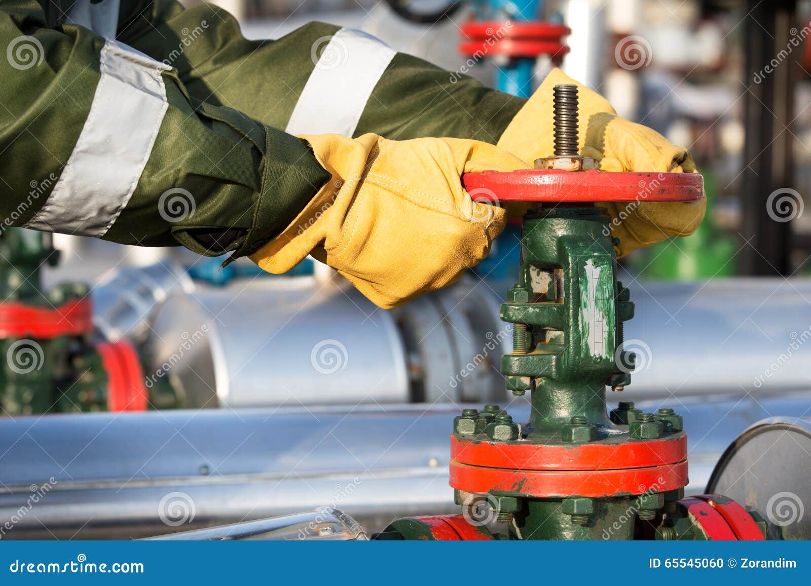 Oil Worker Turning Valve On Oil Rig Royalty-Free Stock Photo ...