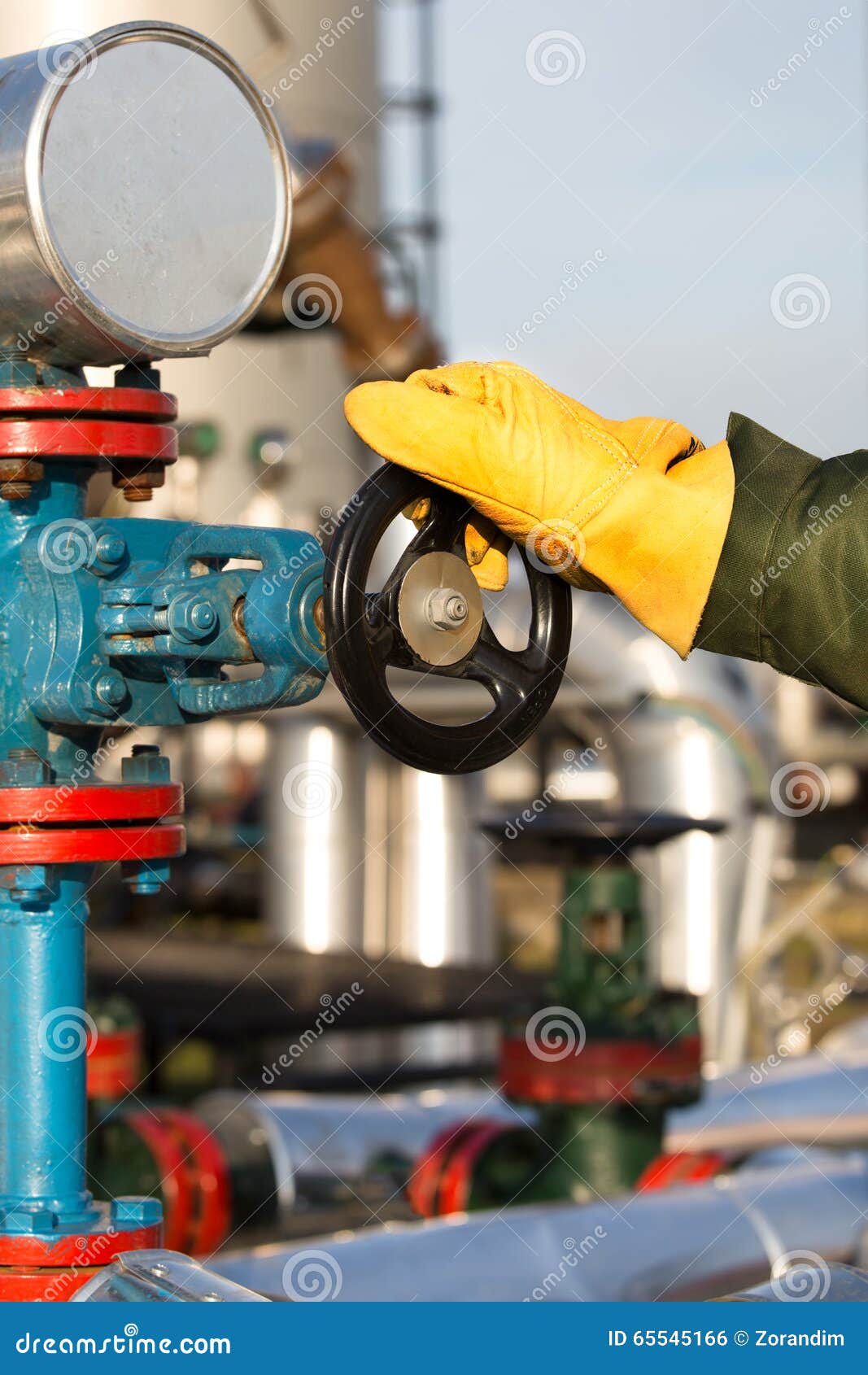 Oil worker turning valve stock photo. Image of crude - 65545166