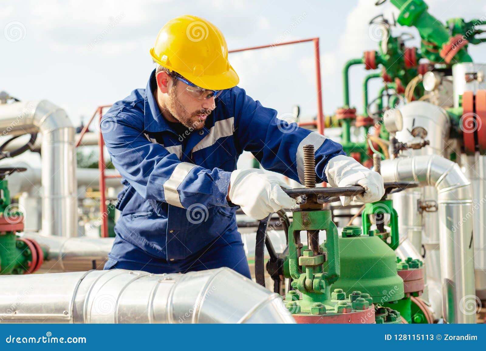 Oil Worker is Turning Valve on the Oil Pipeline Stock Image - Image of ...