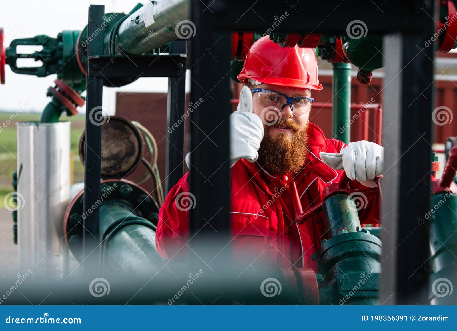 Oil Worker Turning Valve on Oil Rig Stock Image - Image of industry ...