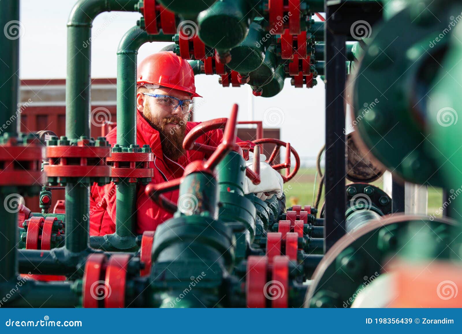 Oil Worker Turning Valve on Oil Rig Stock Image - Image of occupation ...