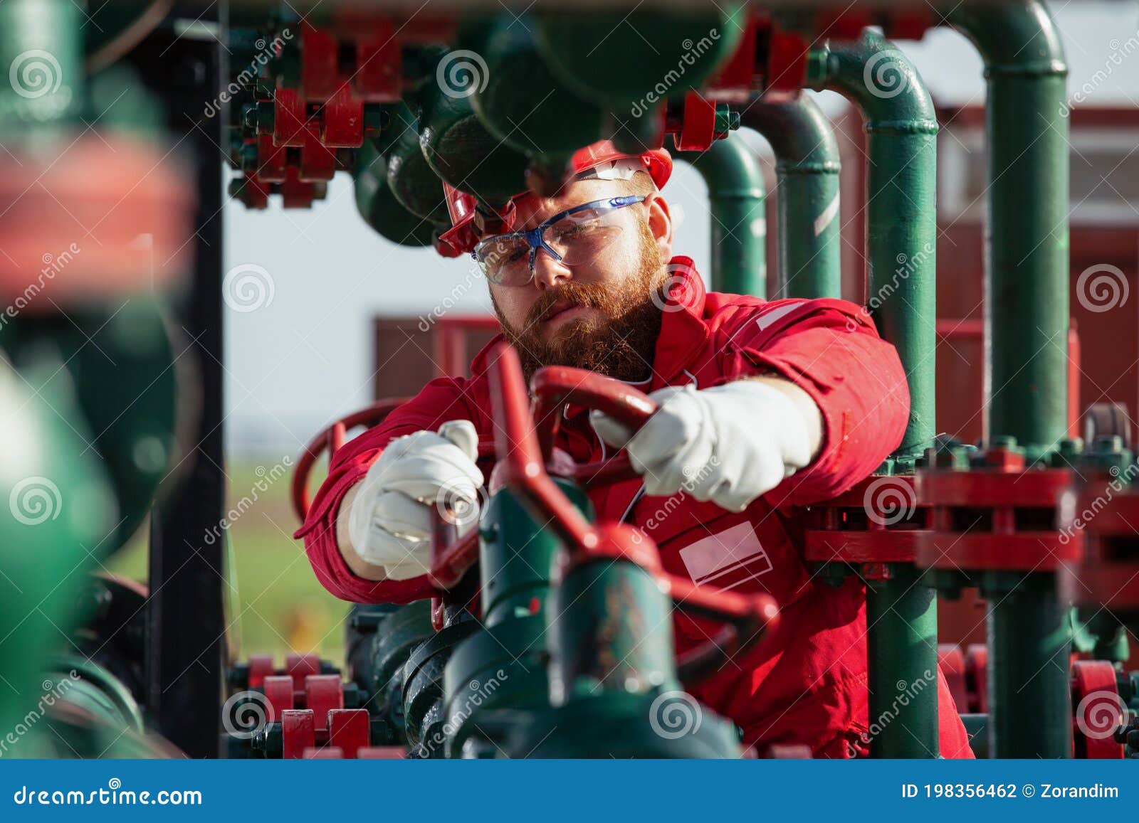 Oil Worker Turning Valve on Oil Rig Stock Photo - Image of drill ...