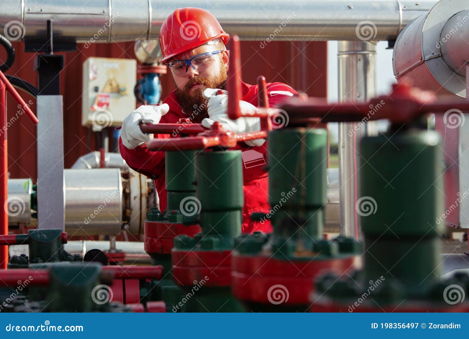 Oil Worker Turning Valve on Oil Rig Stock Image - Image of hard ...