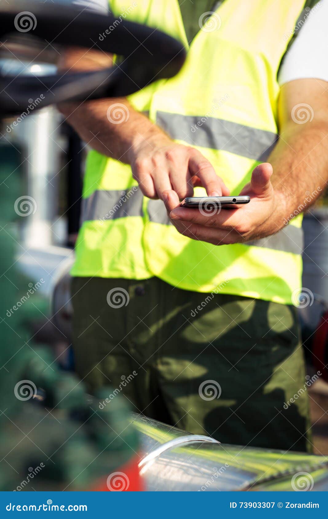 Oil Worker Using Smart Phone Stock Image - Image of hand, reading: 73903307