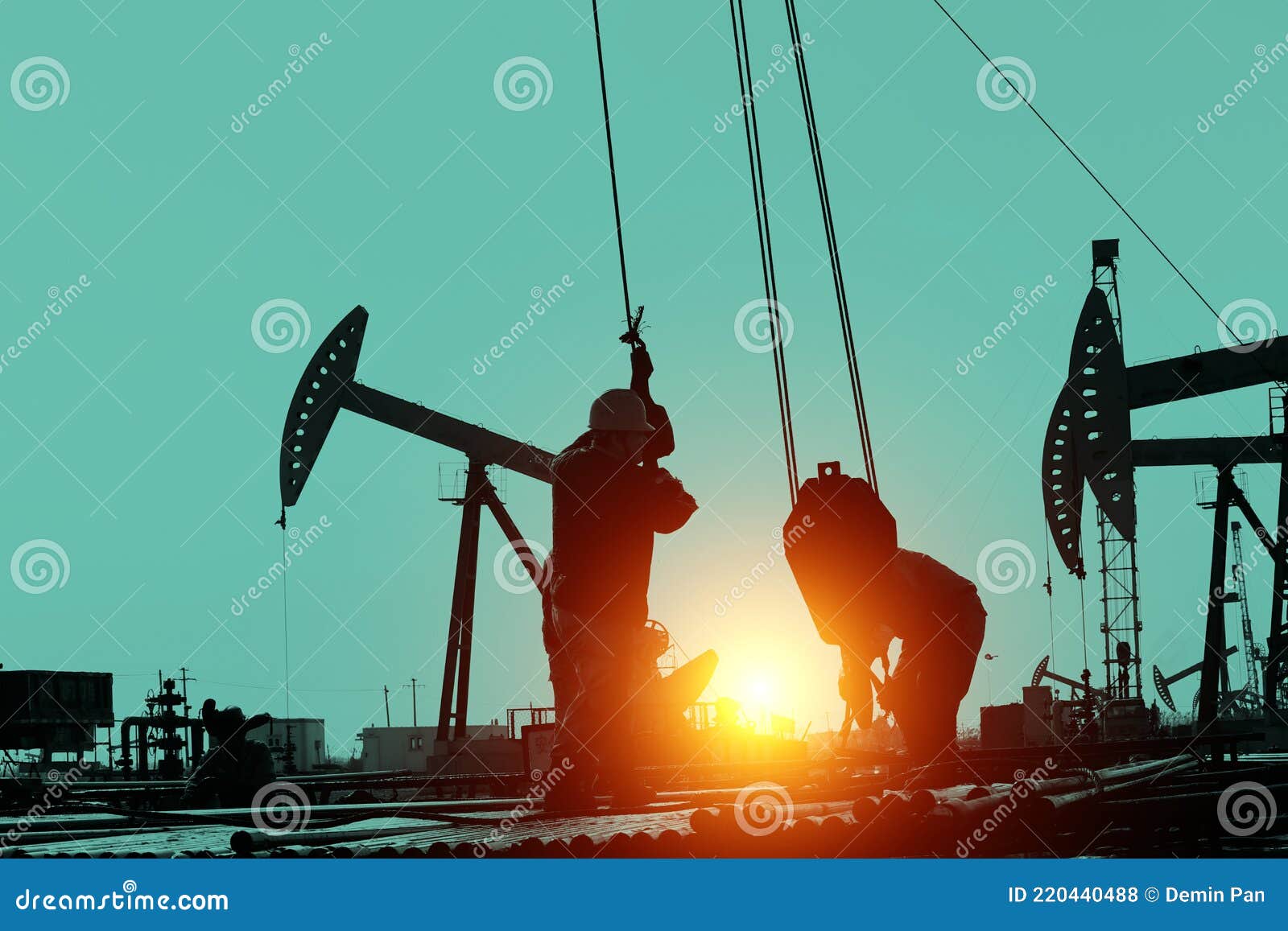 The oil workers at work stock photo. Image of manufacturing - 220440488