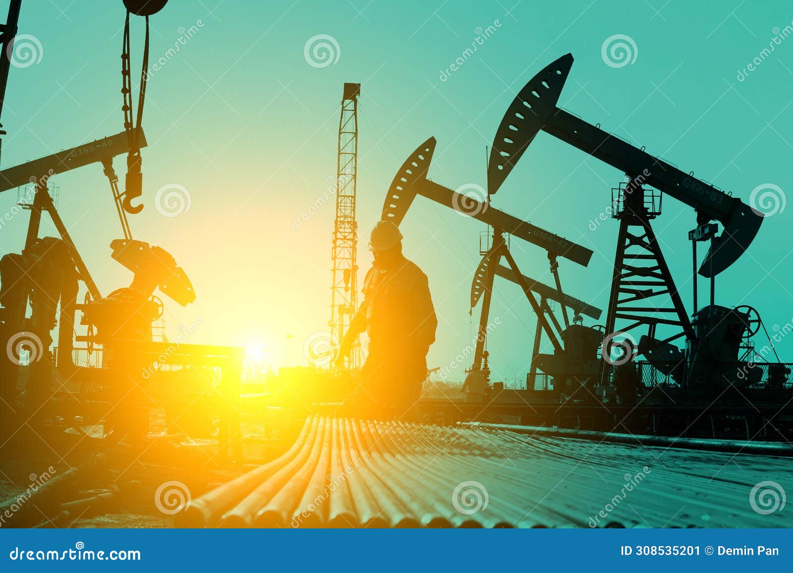 The oil workers at work stock image. Image of evening - 308535201