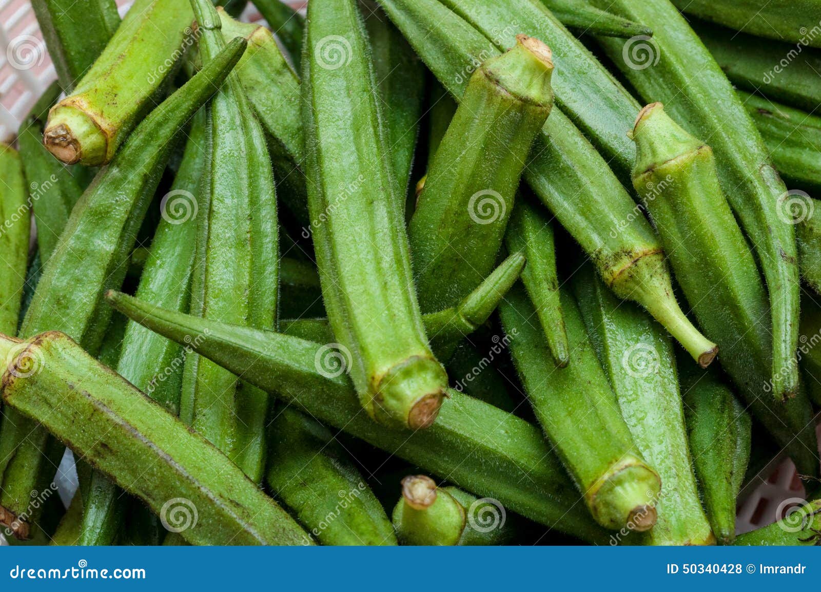 Okra Or Bhindi, Bamia Vegetable Stacked In A Basket On Wood Background ...