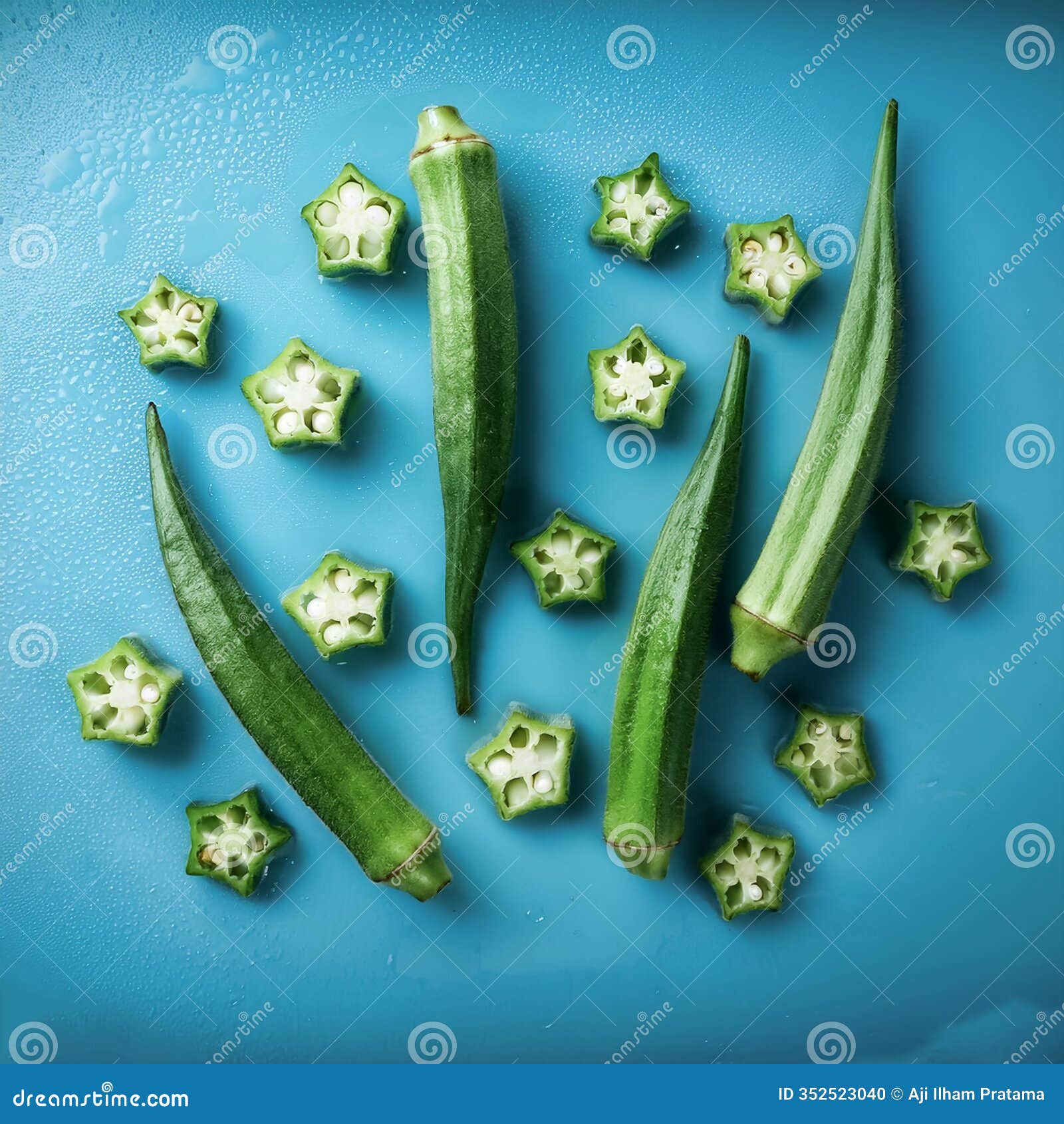 Okra Floating on Blue Clear Water with Glittering Droplets Stock Photo ...
