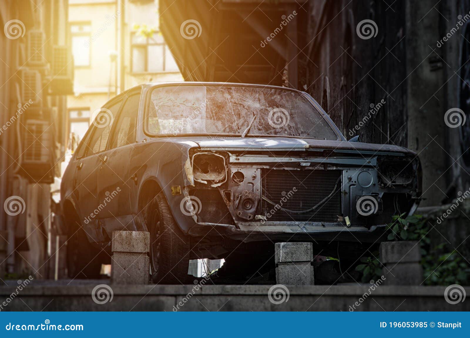 An Old Abandoned Broken and Rusty Blue Car without Headlights and a ...