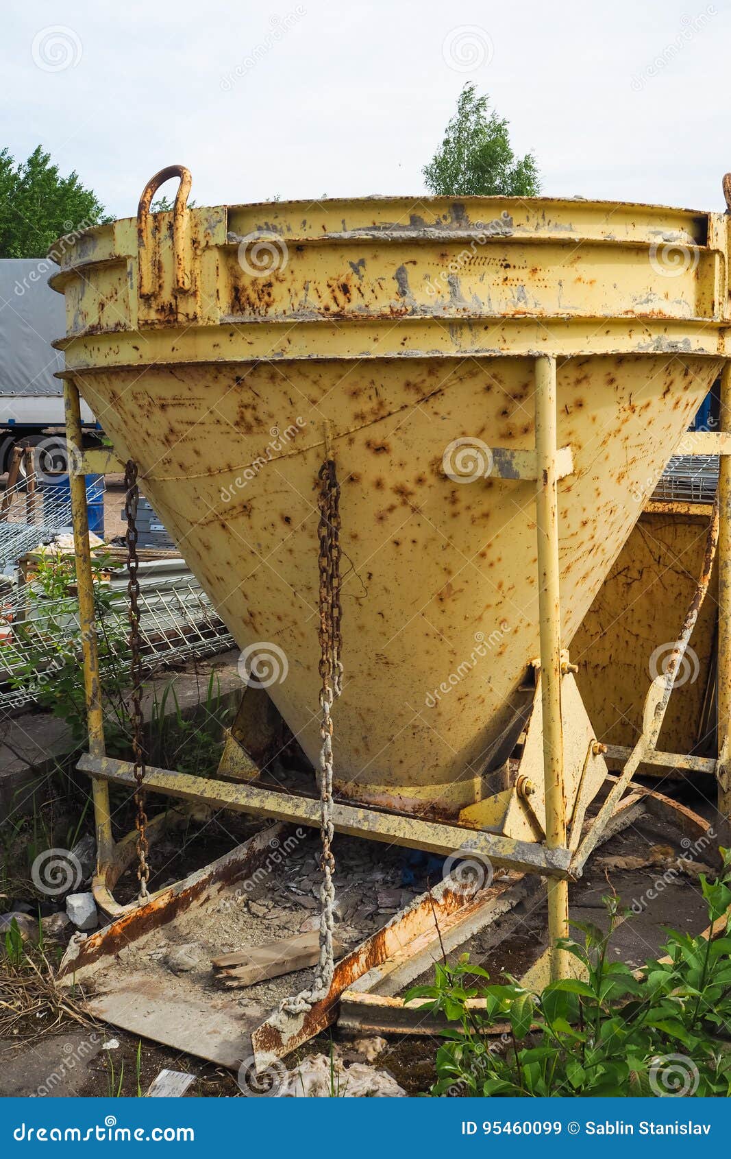 Old Abandoned Construction Concrete Bucket in the Scrap Yard. Stock ...