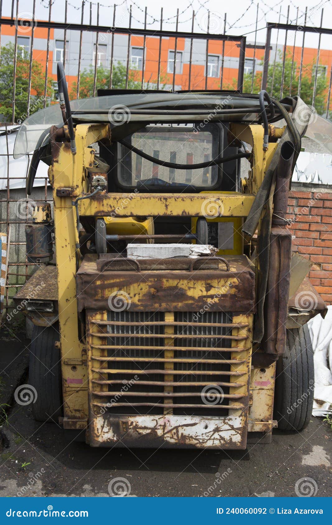 Old Abandoned Damaged Rusty Yellow Mini Loader Tractor Vertical Close ...