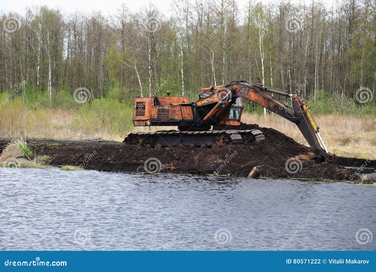 Old Abandoned Excavator on Peat Bogs in the Middle of the Water Stock ...