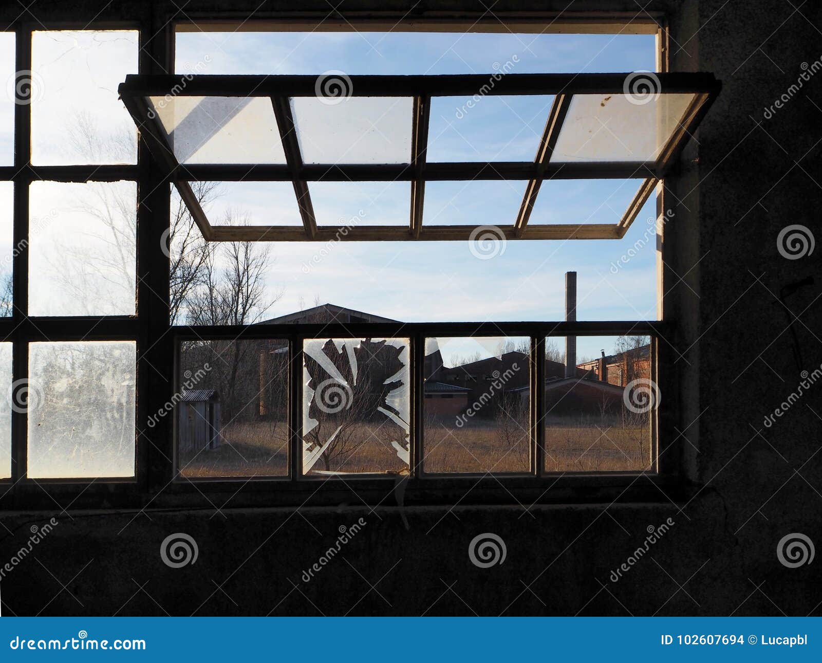 Old Abandoned Factory Viewed through a Half Open Window Stock Photo ...