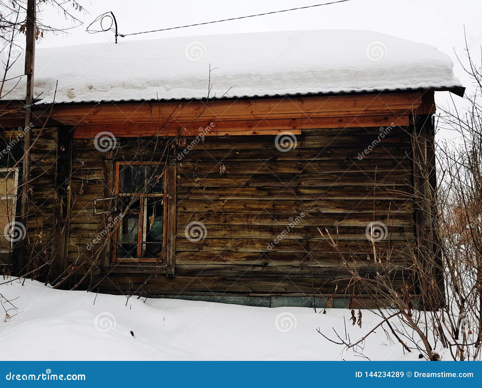 Old Abandoned House with a Broken Window on the Background of Snow in ...